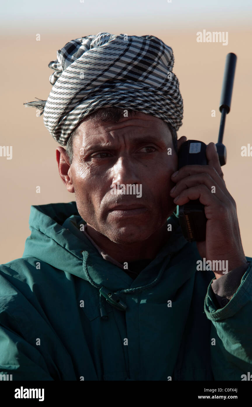Satellite Phone Communication- a Middle Eastern man with serious ...