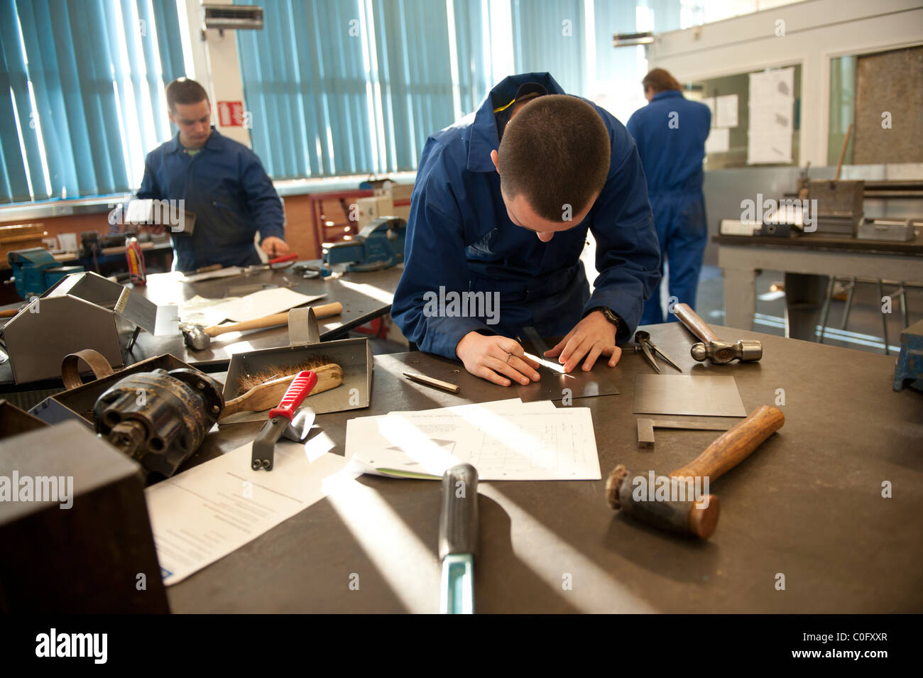 Young Adults learning metal working skills at a college of further ...