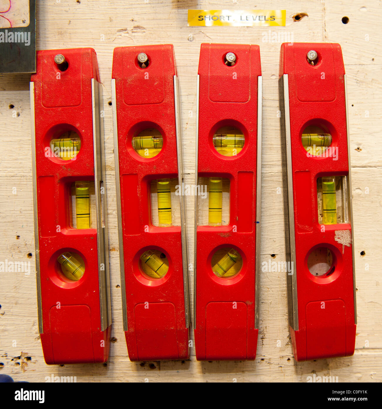 Four red plastic spirit levels Stock Photo - Alamy
