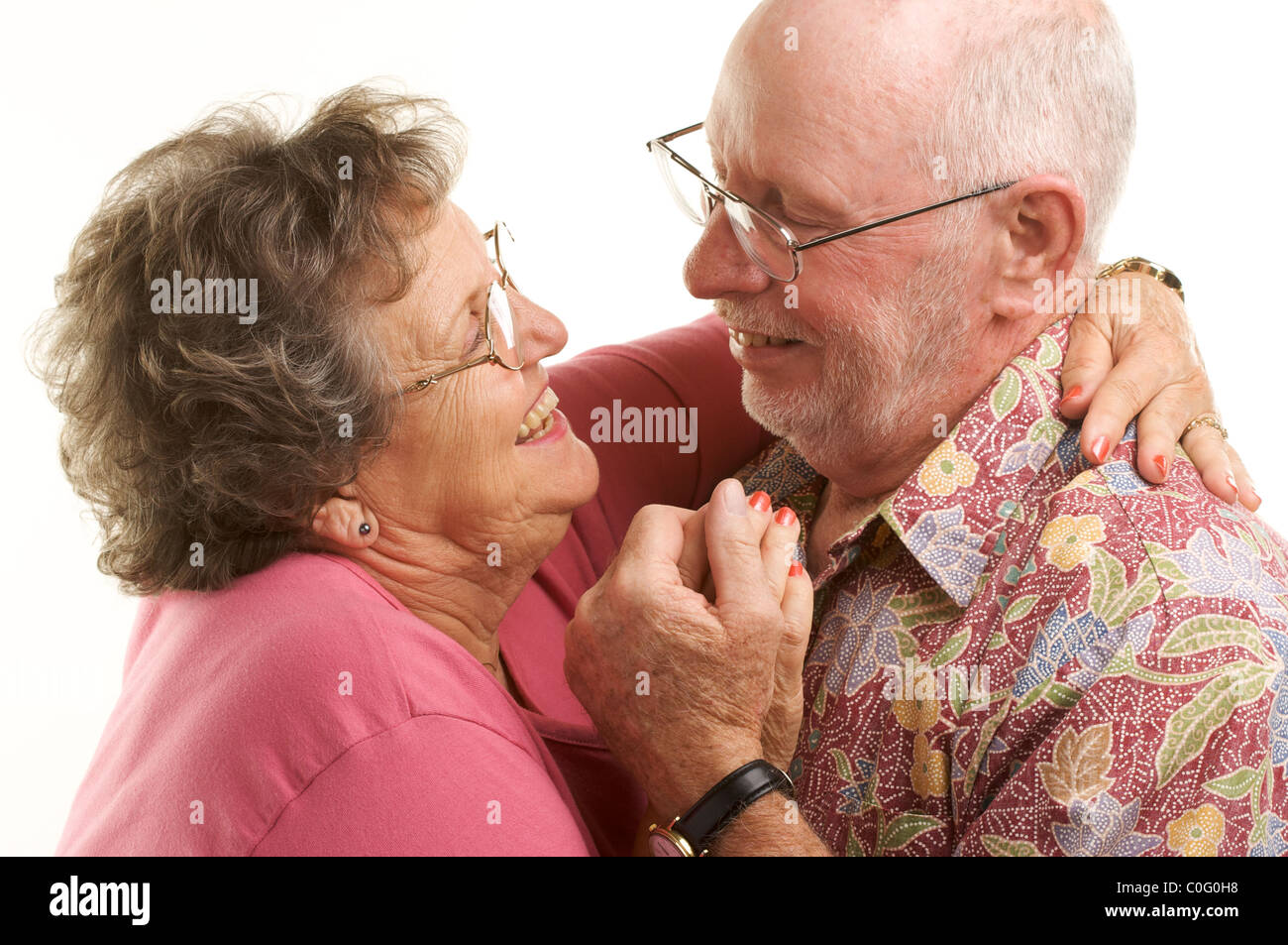 Happy Senior Couple Romantically Dancing on a White Background Stock ...