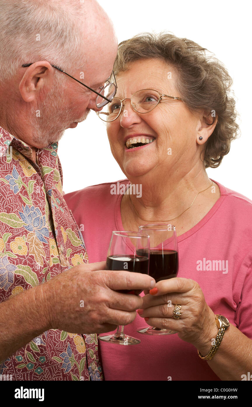 Happy, Smiling Senior Couple Facing Each Other and Toasting with Wine ...