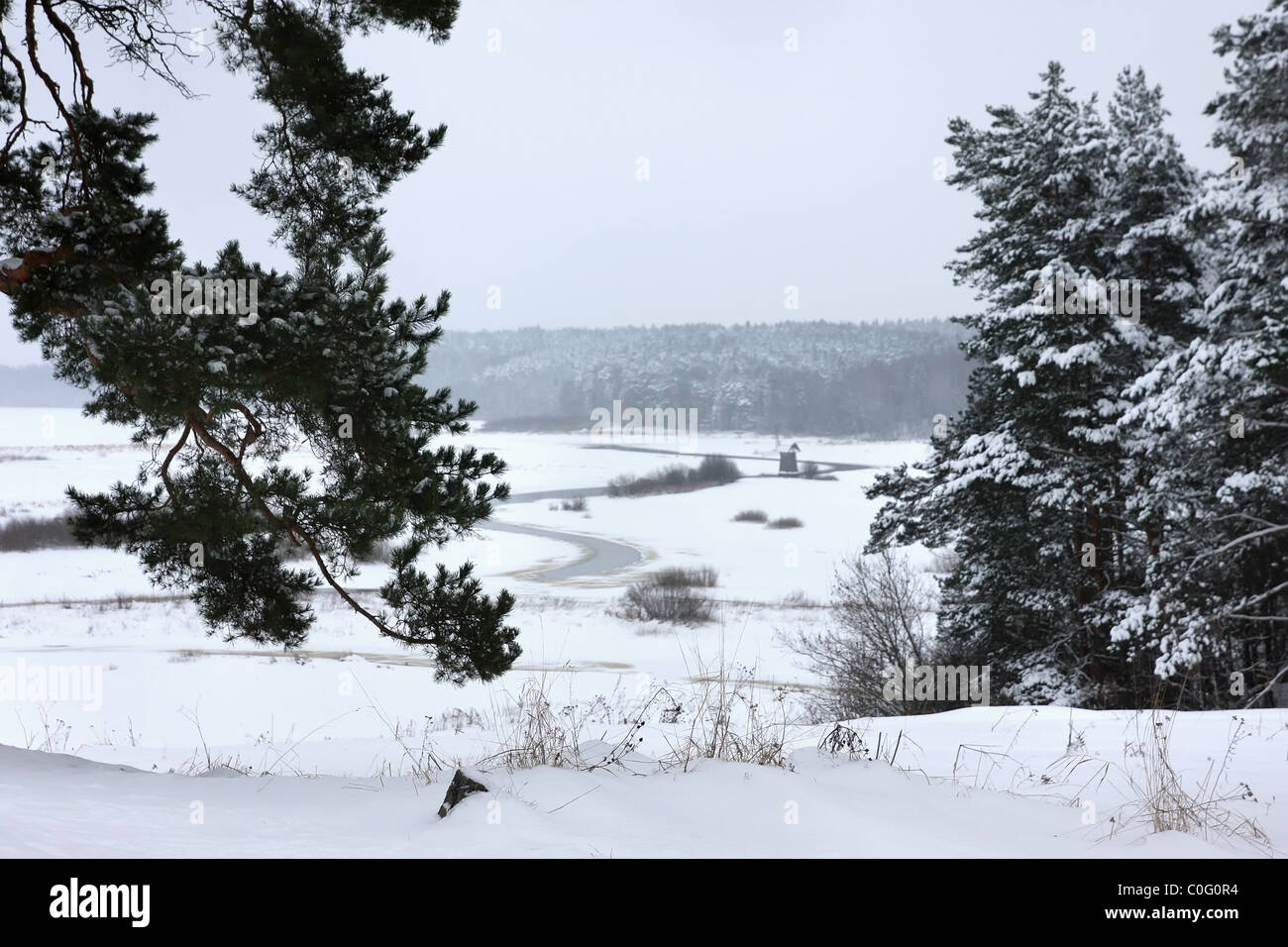 Winter valley with a windmill and a river Stock Photo - Alamy