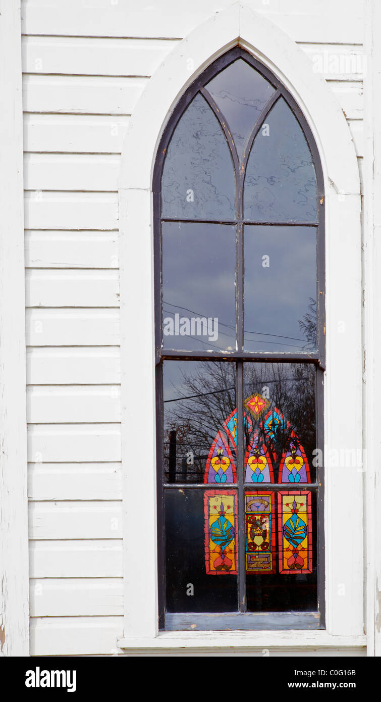 Old church window with view of beautiful stained glass on the other ...