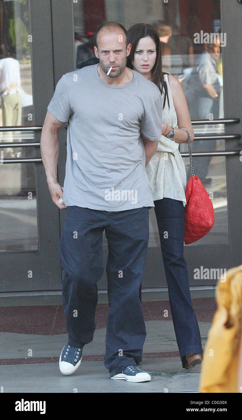 Jason Statham and his girlfriend leave a movie theatre after watching ...