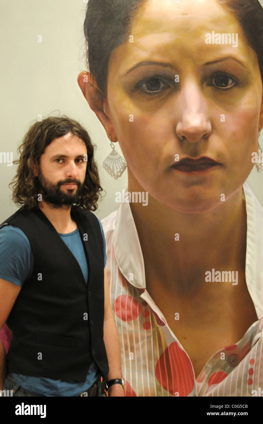 Shortlisted artist Craig Wylie with his portrait 'For K' 2008 BP ...