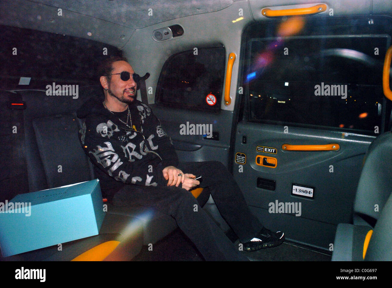 David Guest driving past Nobu Restaurant in Mayfair in a taxi. London ...