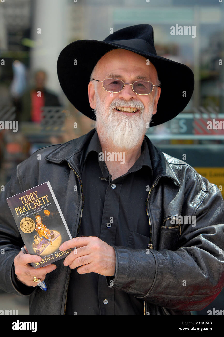 Terry Pratchett signing copies of his book 'Making Money' at Royal ...