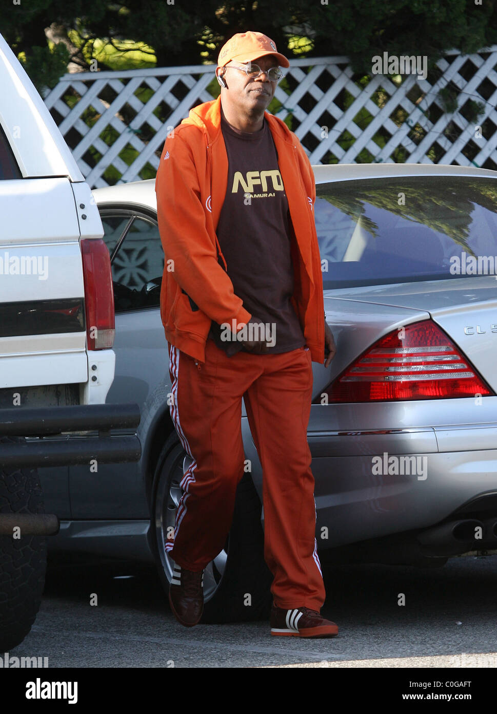 Samuel L. Jackson, dressed head to toe in orange sportswear, just like ...