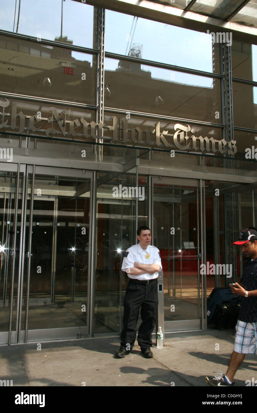 A security guard stands in front of the New York Times building to ...