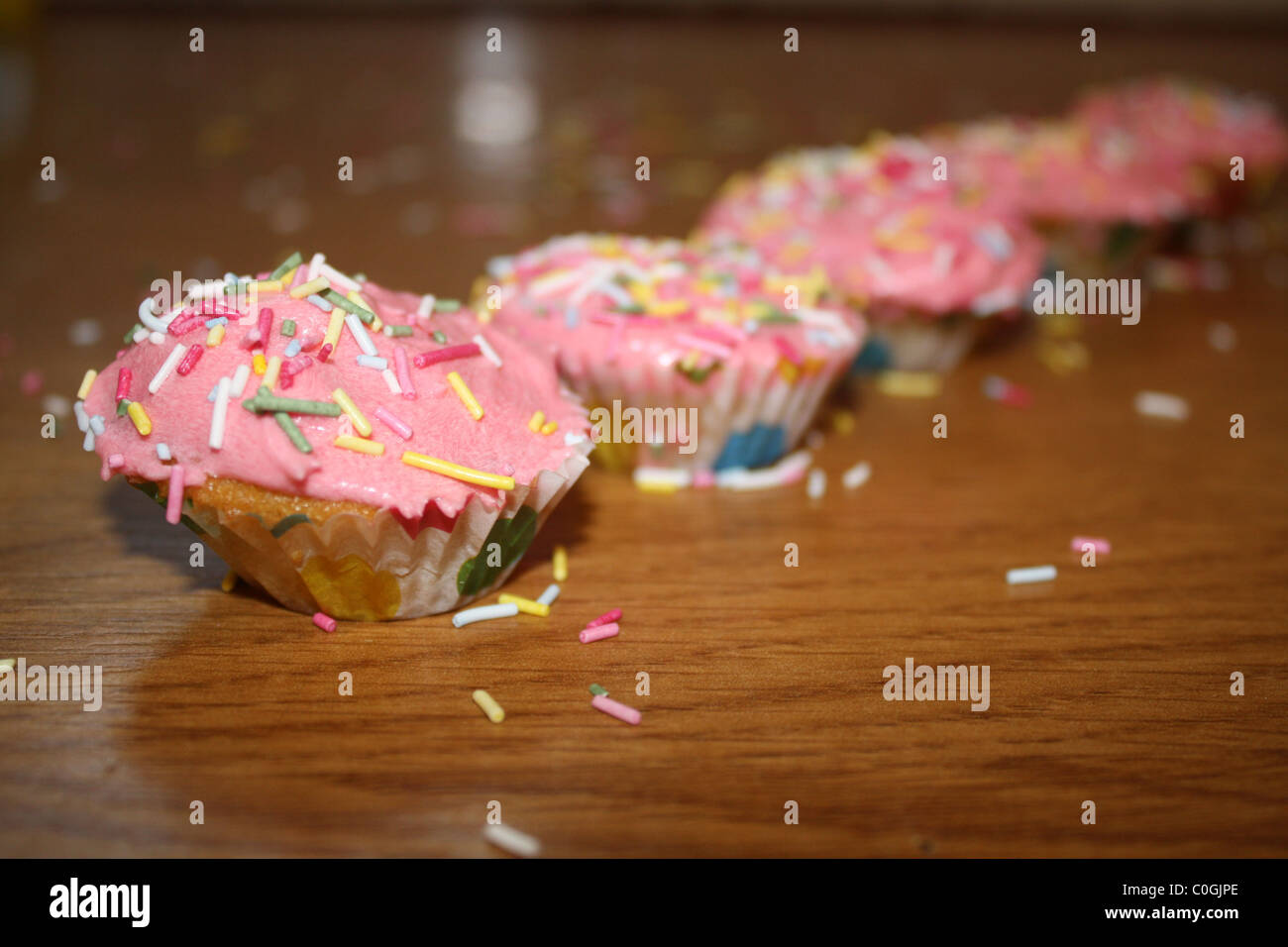 Cupcakes in a line Stock Photo - Alamy