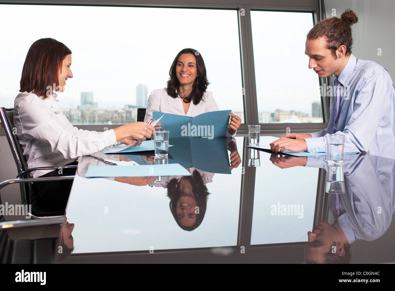 Checking the files in the meeting room Stock Photo - Alamy