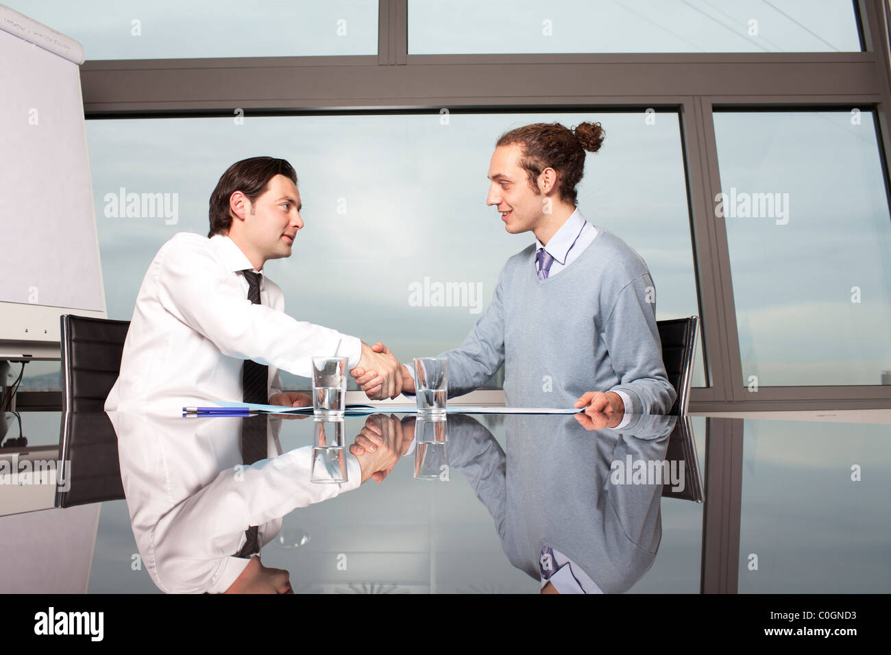 Handshake in Office Stock Photo - Alamy