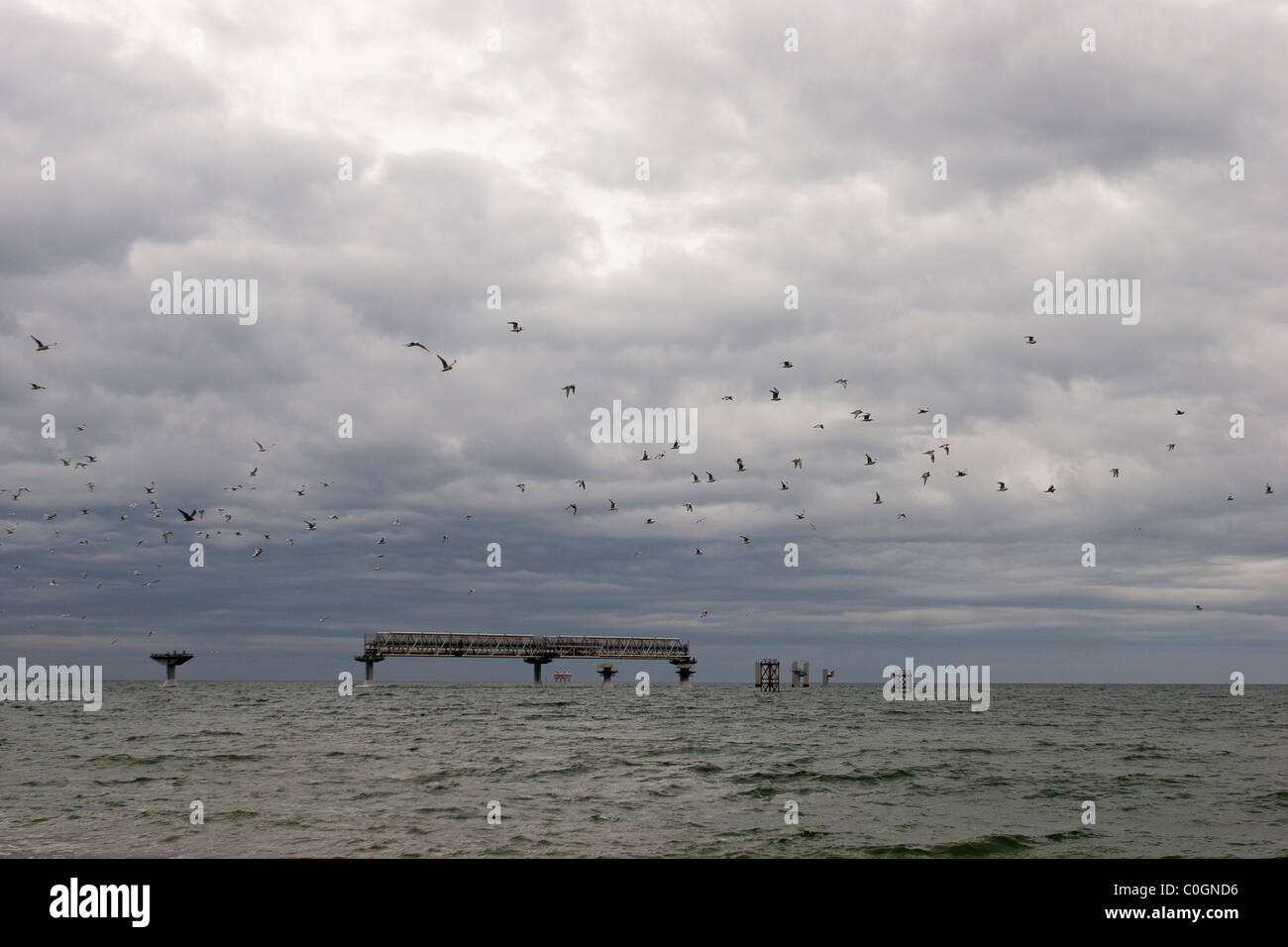The gas loading jetty under construction offshore from the Sakenergy ...