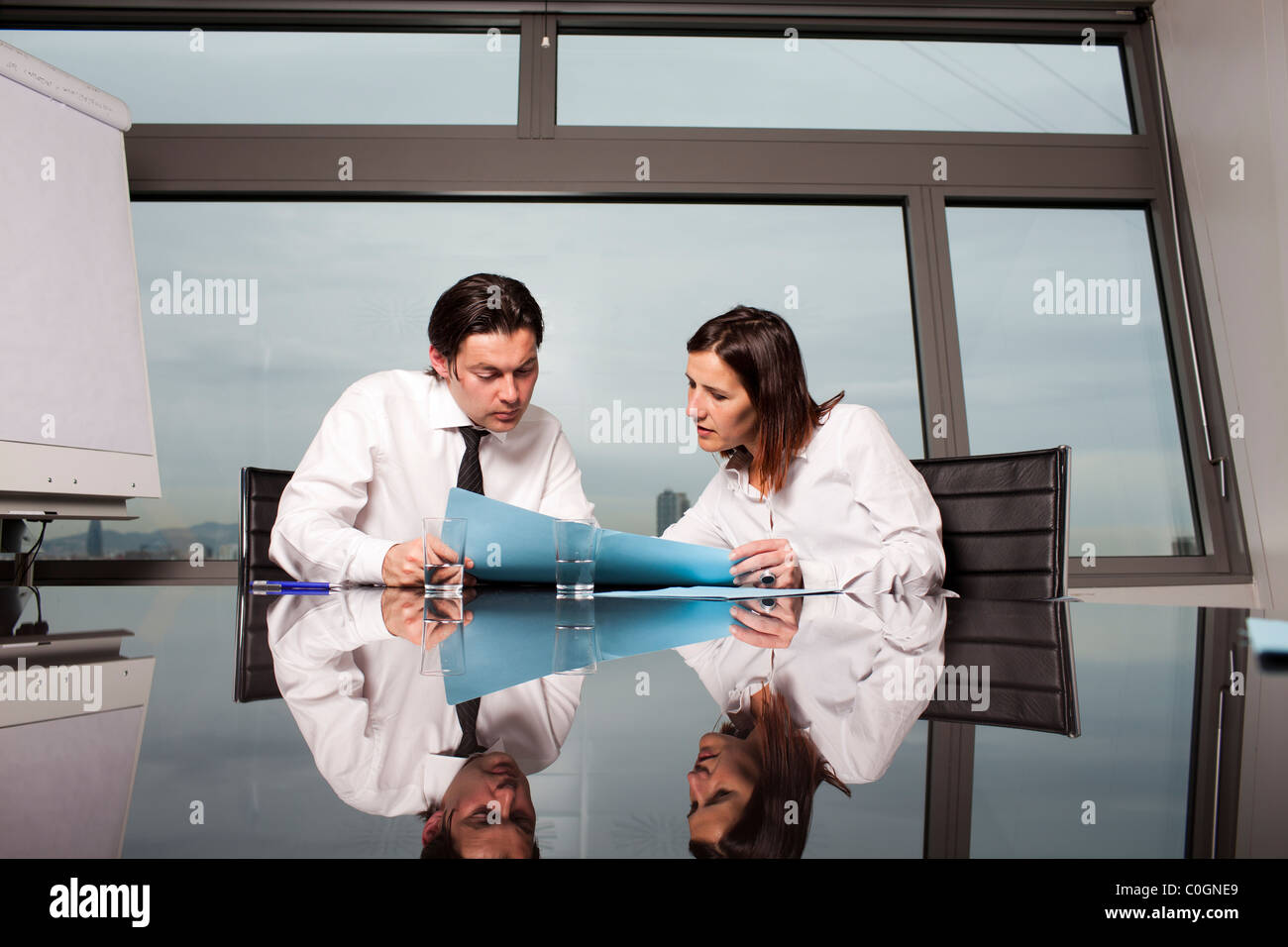 Checking the files in the meeting room Stock Photo - Alamy