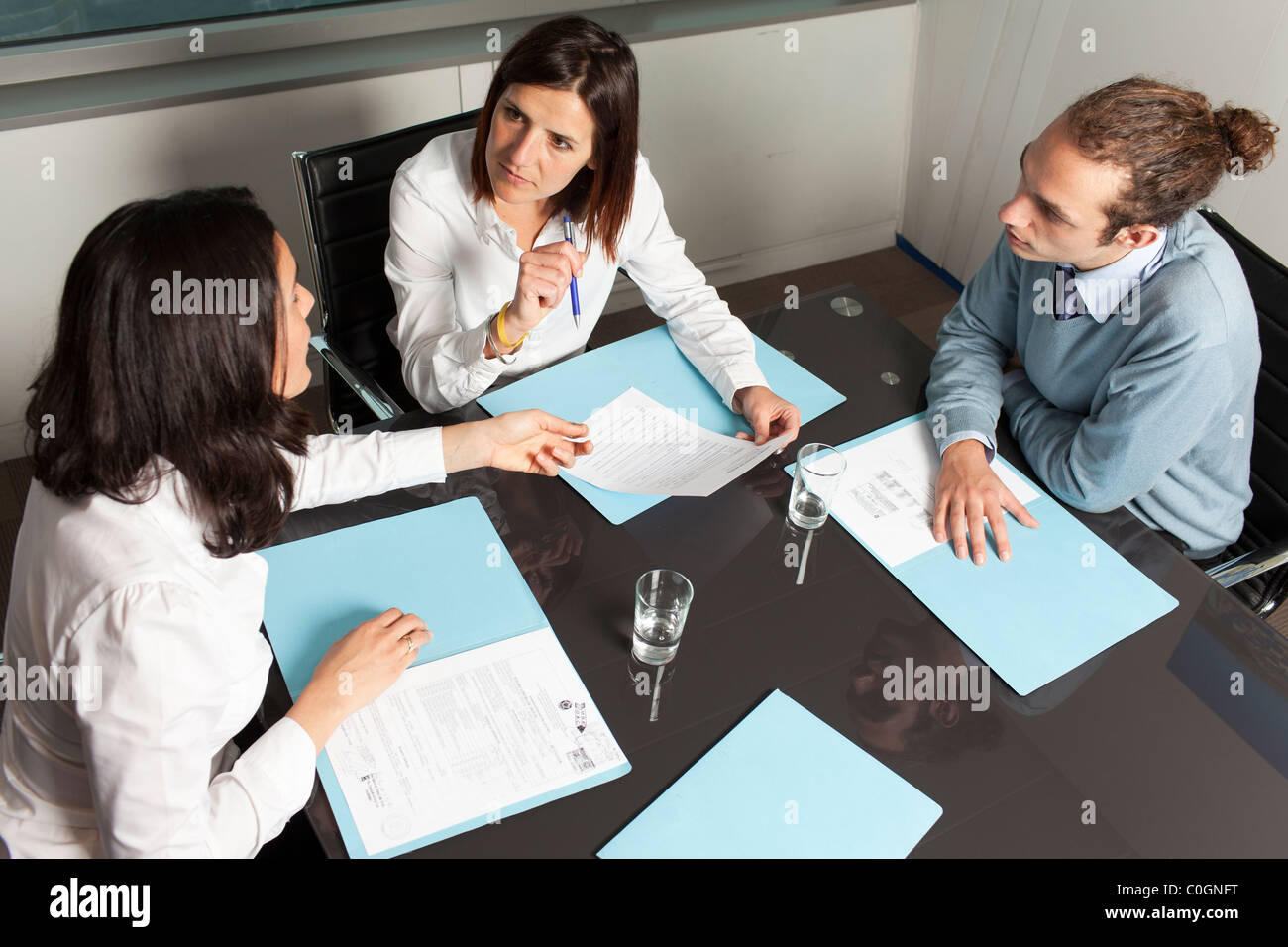 Checking the files in the meeting room Stock Photo - Alamy