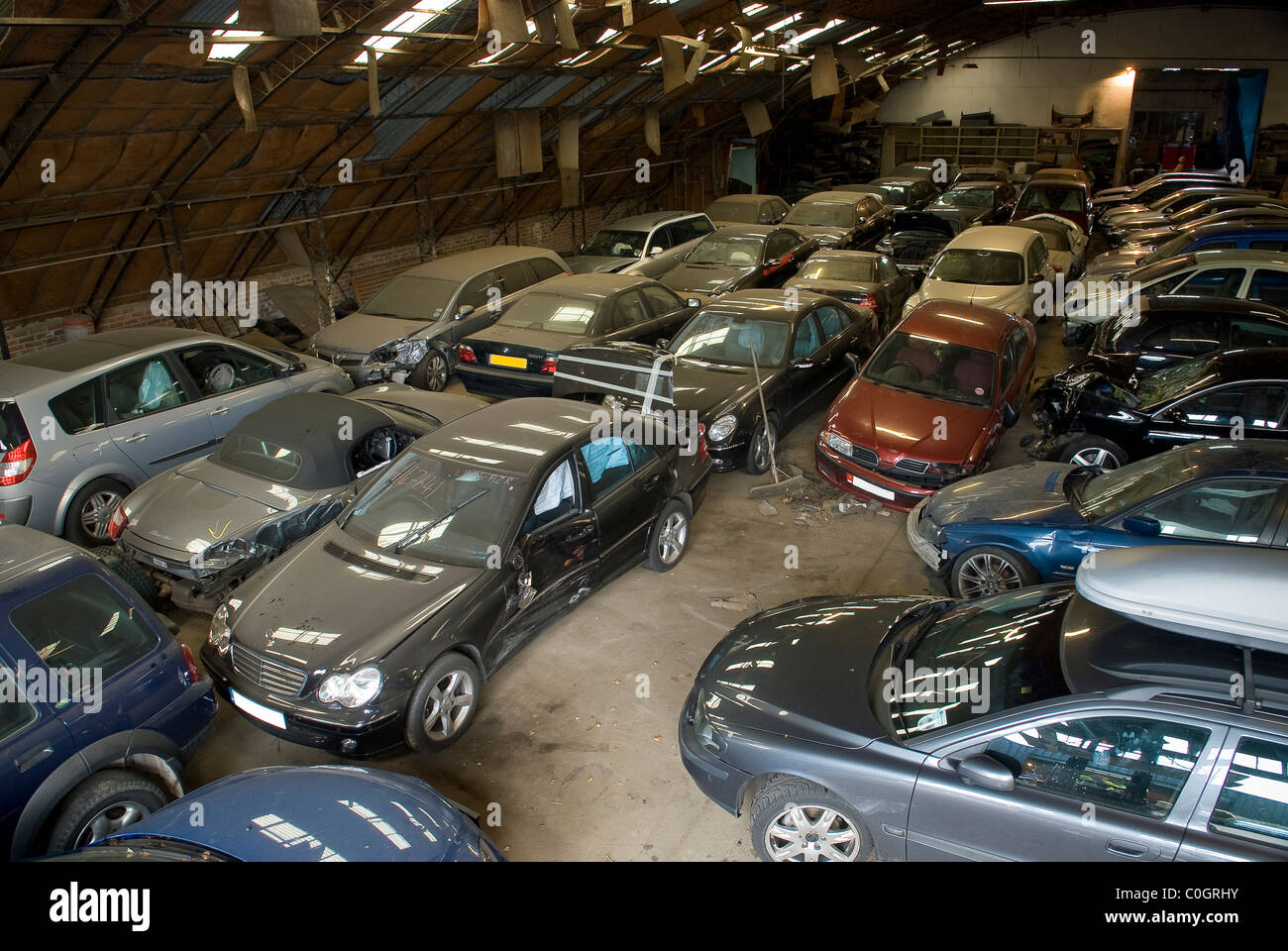 Recovered crashed or stolen vehicles in a car pound, West Sussex, UK ...