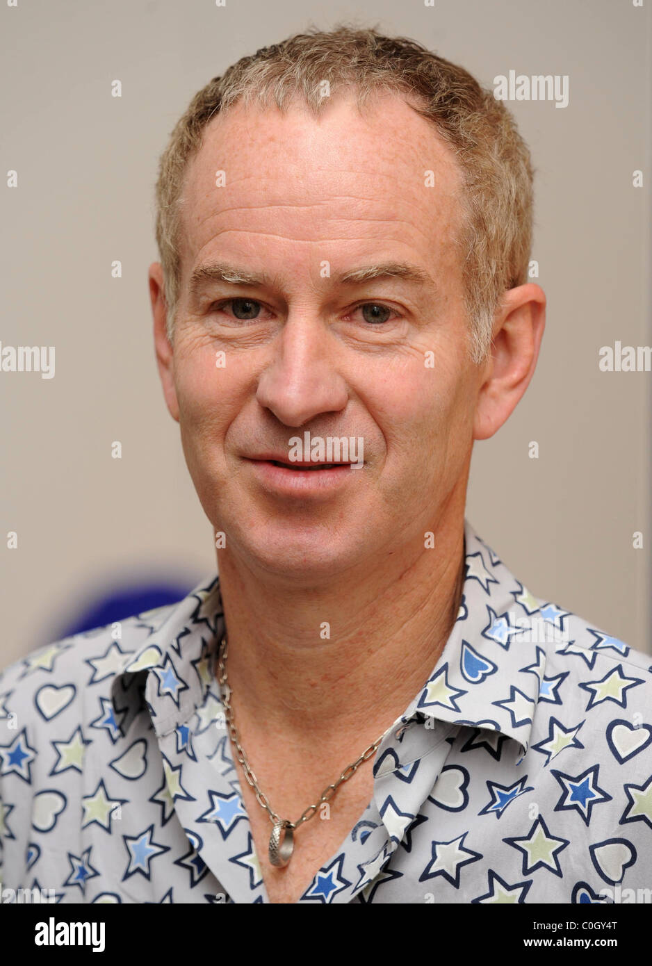 John McEnroe attends a photocall with Andy Warhol's 'Portrait of John ...