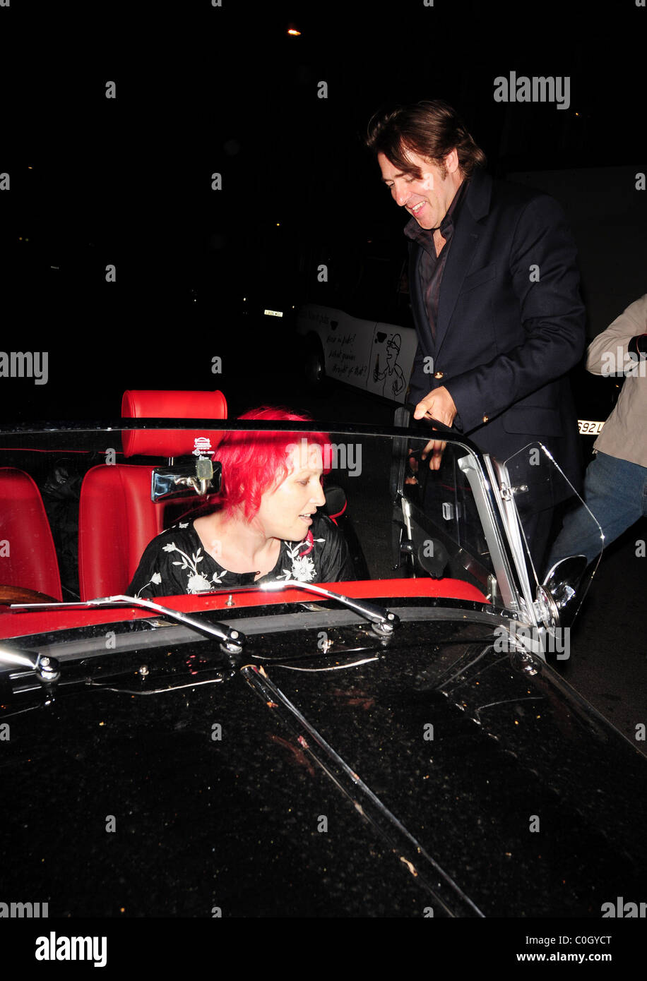 Jonathan Ross climbs into and squeezes into the driving seat of his ...