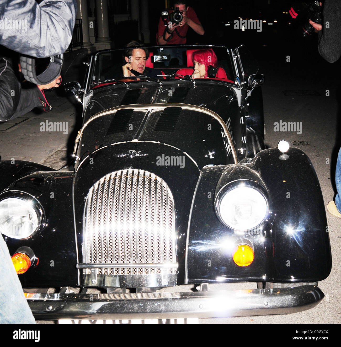 Jonathan Ross climbs into and squeezes into the driving seat of his ...