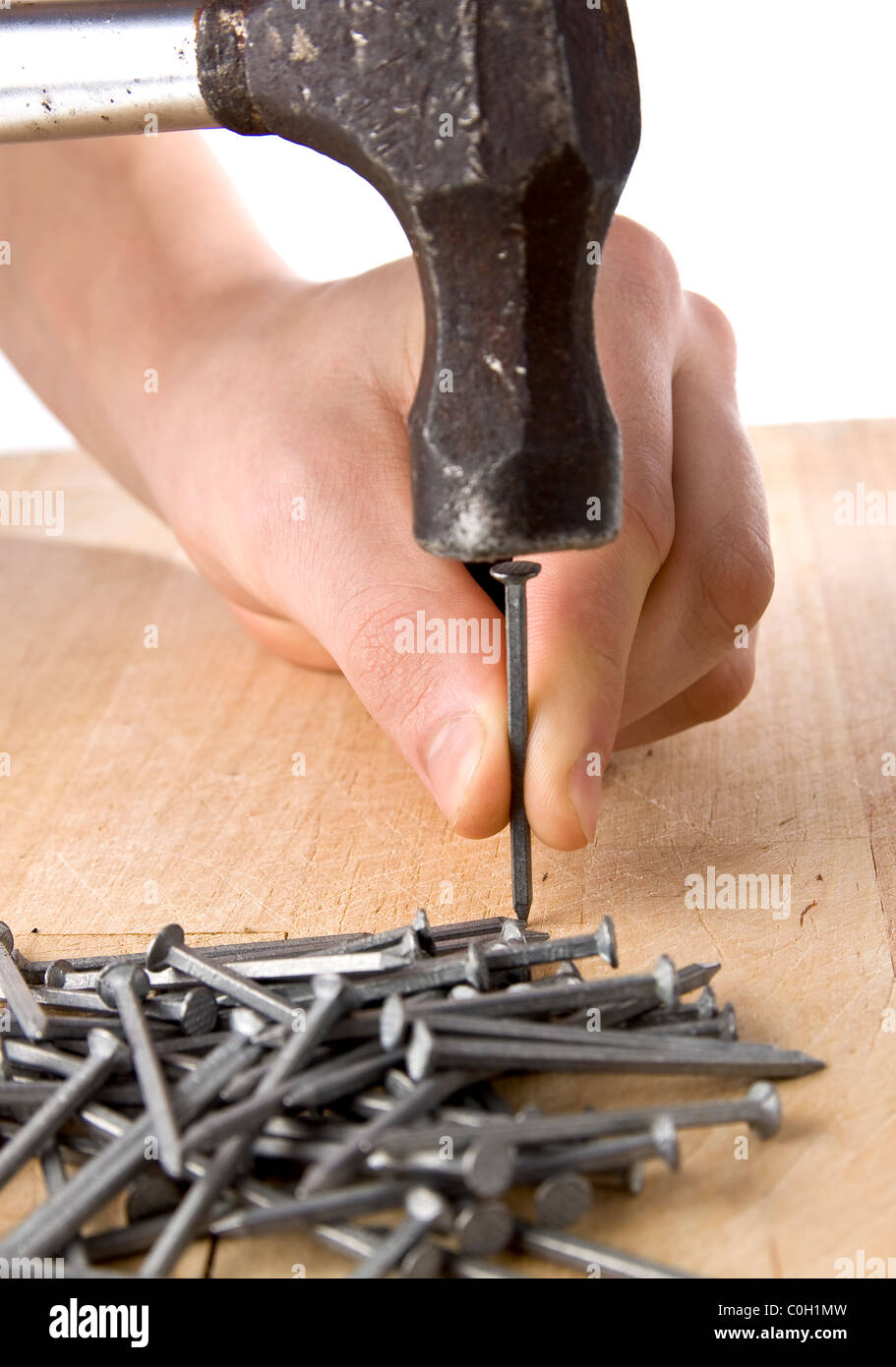 Hammer nail in head hi-res stock photography and images - Alamy