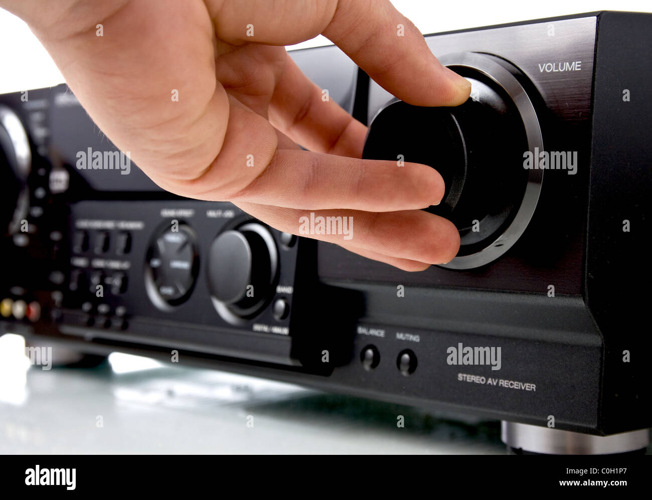 Audio amplifier and hand volume down Stock Photo - Alamy