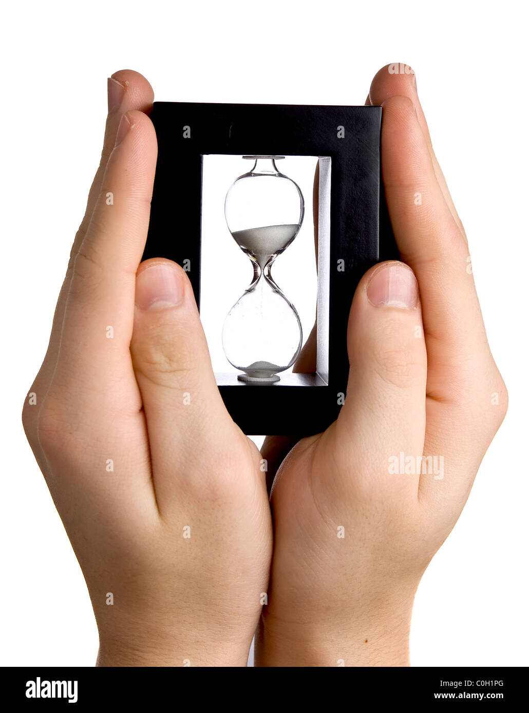 Hands holding hourglass isolated on white background Stock Photo - Alamy