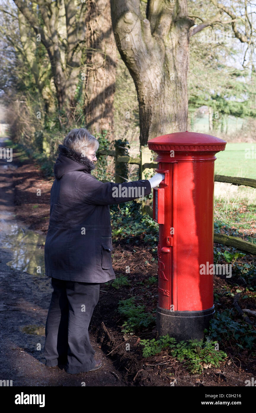 Lady posting letter in a post box Stock Photo - Alamy Lady posting letter in a post box Stock Photo - Alamy