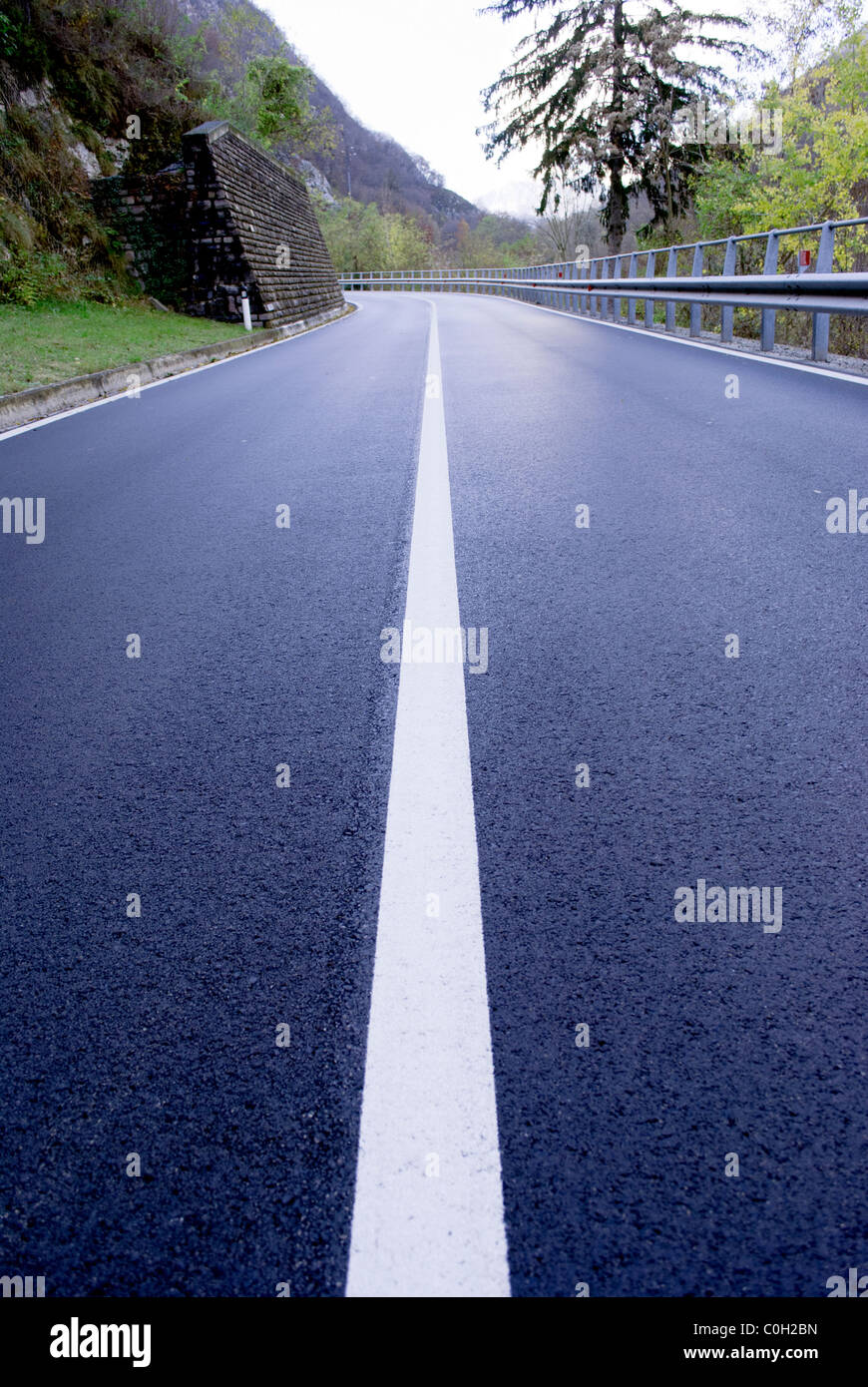 paved road with white lines on black background Stock Photo - Alamy