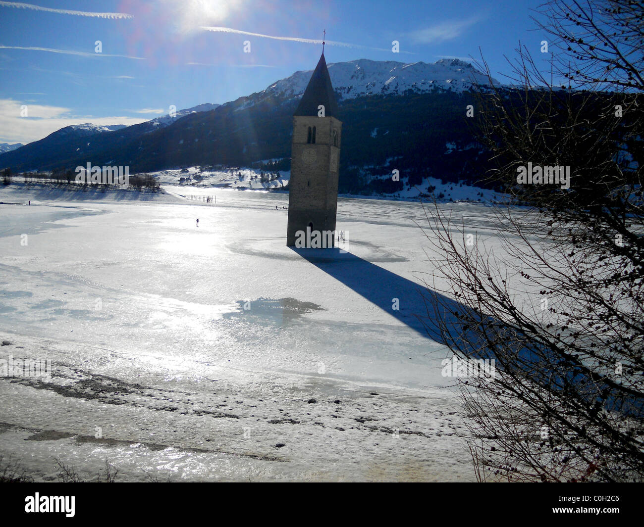 Reschensee frozen in winter with a bell tower in the lake Stock Photo ...