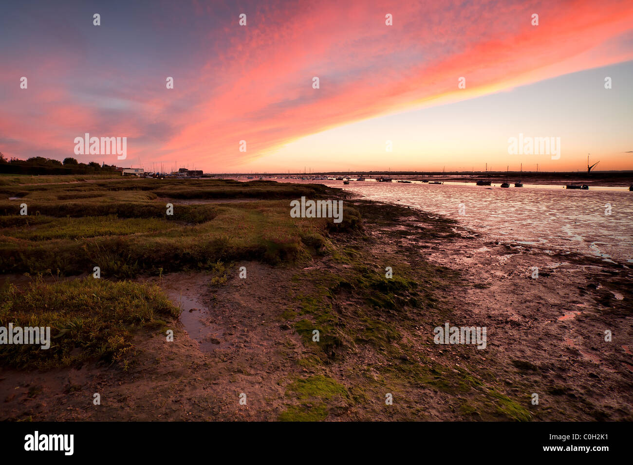 Sunset over the salt marshes on Mersea Island Stock Photo - Alamy