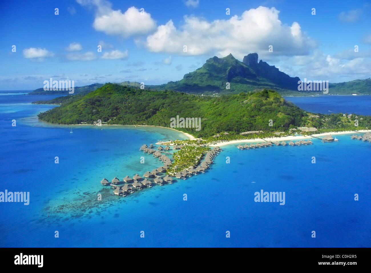 Aerial View of Bora Bora with Mount Otemanu in background and coral ...