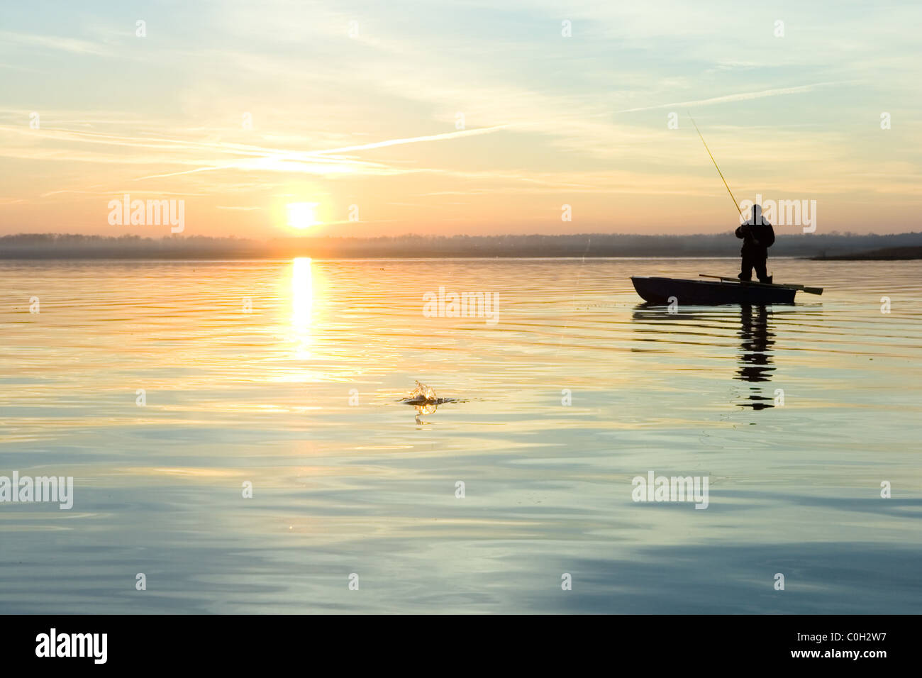 fisherman on boat. catching pike Stock Photo - Alamy