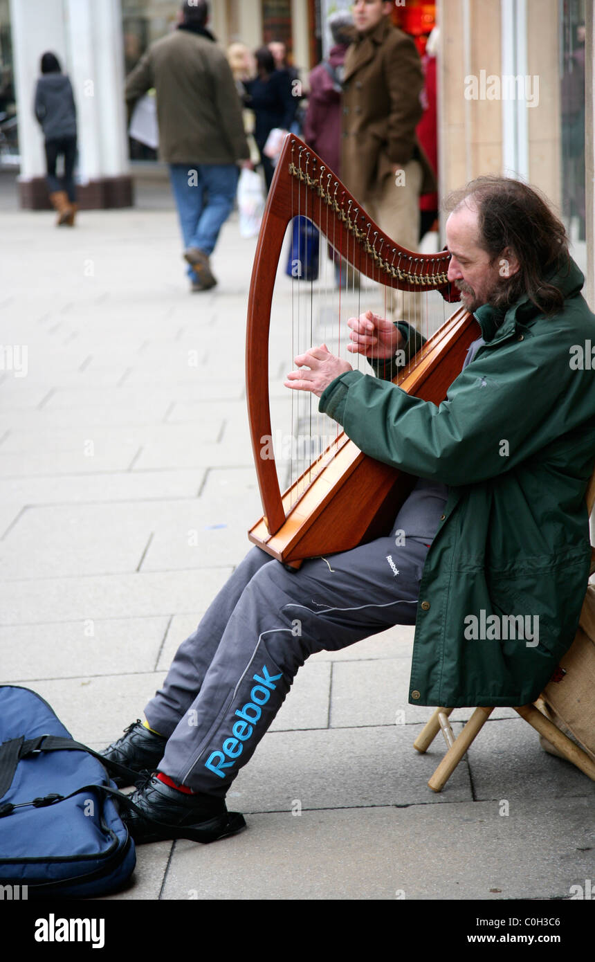 Harpist busker hi-res stock photography and images - Alamy