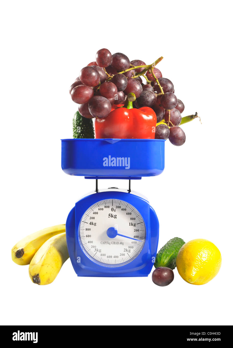 Fruit and vegetables on scales Stock Photo - Alamy