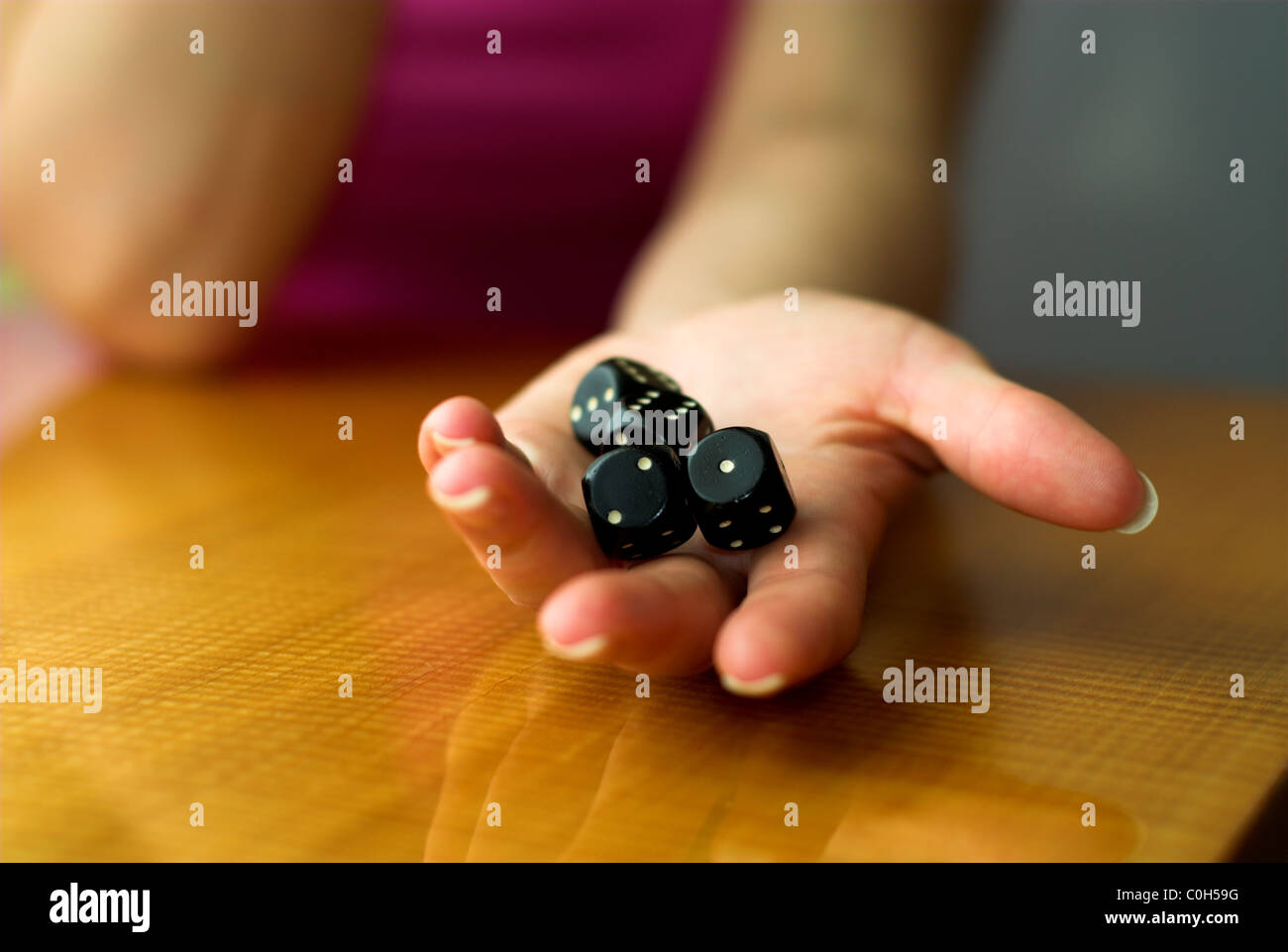 Young female is holding cubes in her hand Stock Photo - Alamy