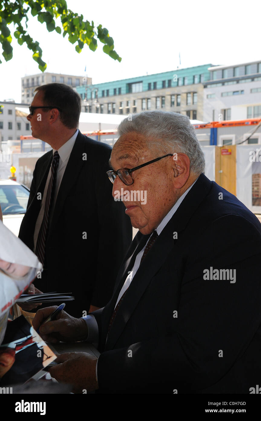 Henry Kissinger signing autographs while arriving at Adlon Hotel Berlin ...