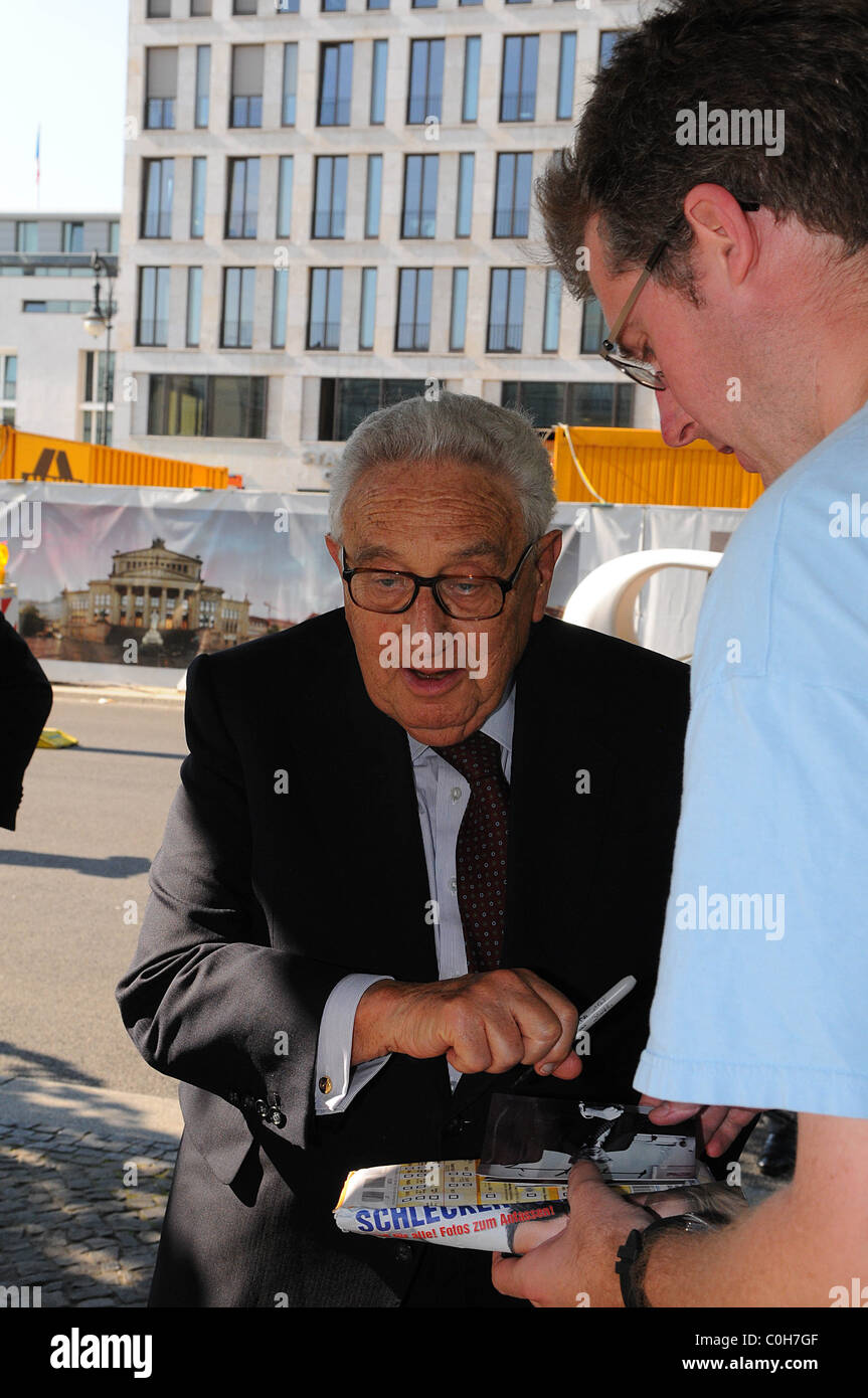 Henry Kissinger signing autographs while arriving at Adlon Hotel Berlin ...