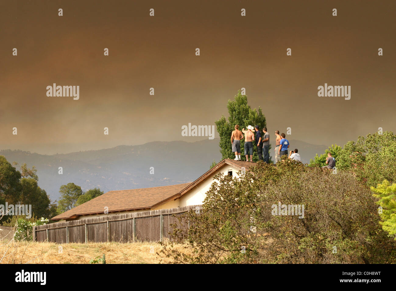 Residents watch the Gap Fire in Santa Barbara County as more than 1,000 ...