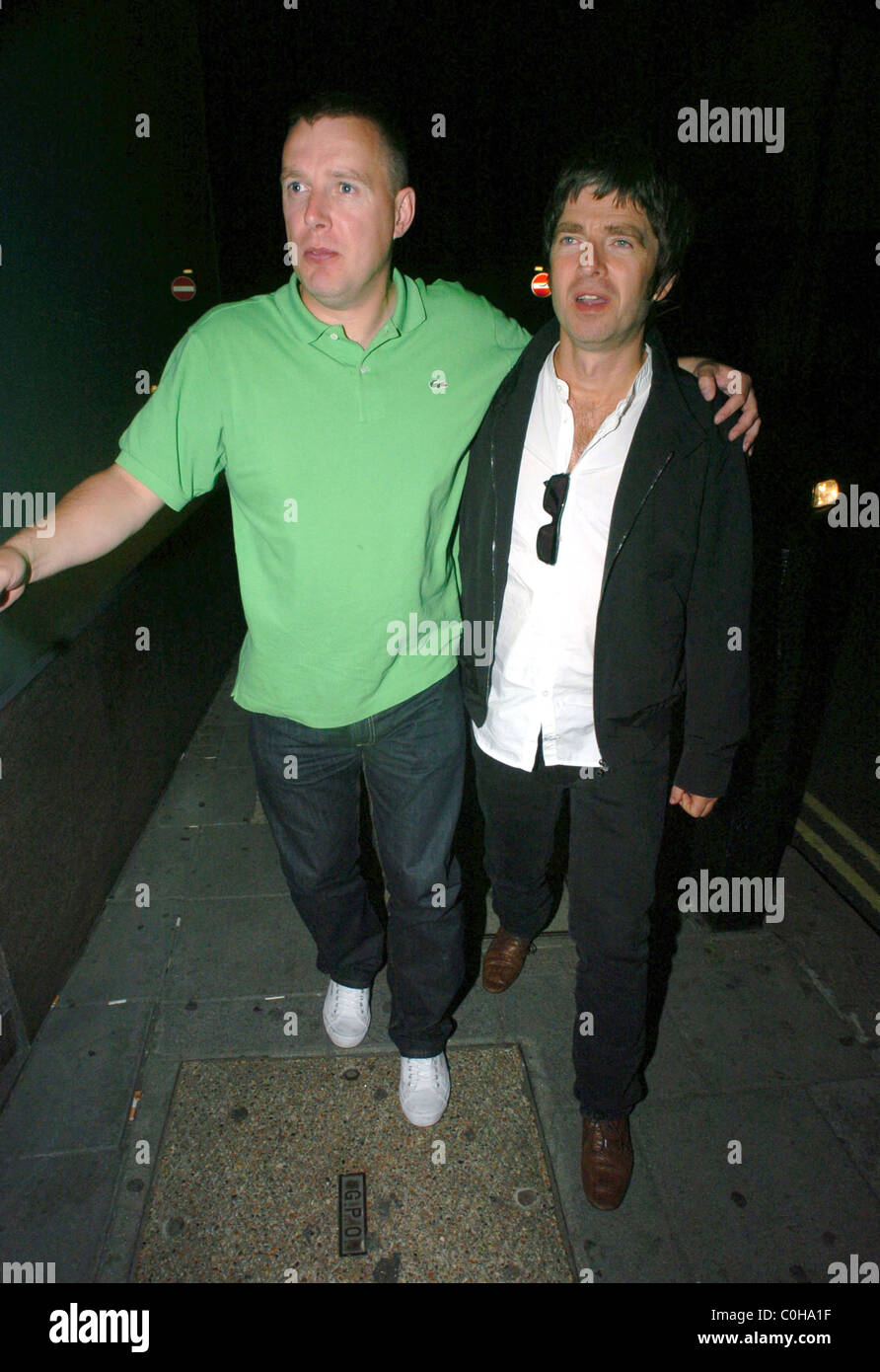 Noel Gallagher and a friend in high spirits Outside the Met Bar London ...