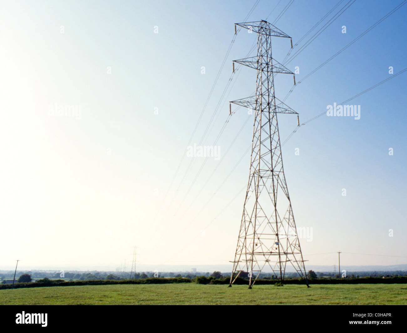 Electricity pylon towering overhead Stock Photo - Alamy