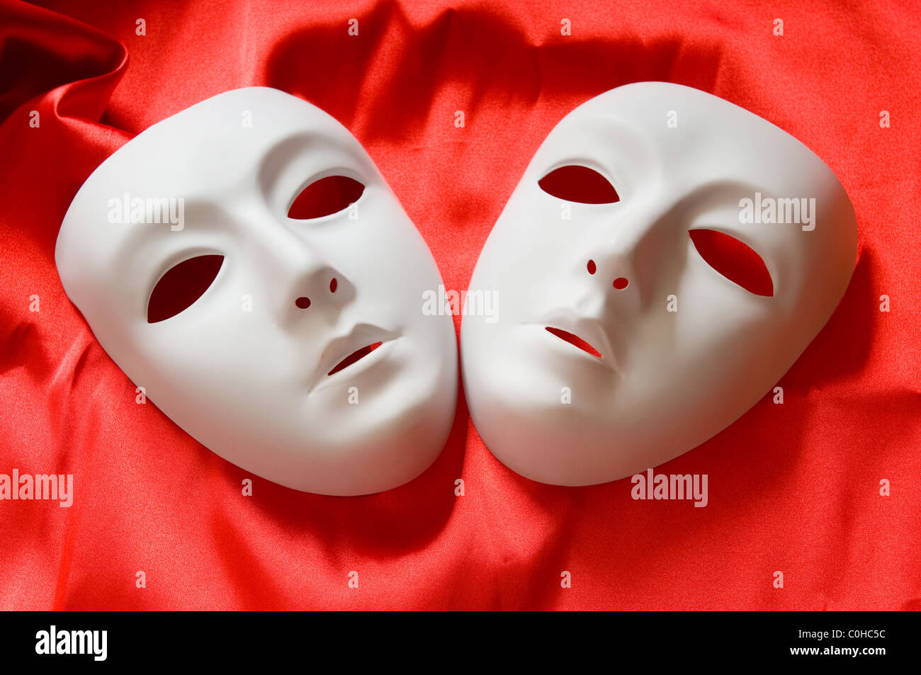 Theatre concept with the white plastic masks Stock Photo - Alamy