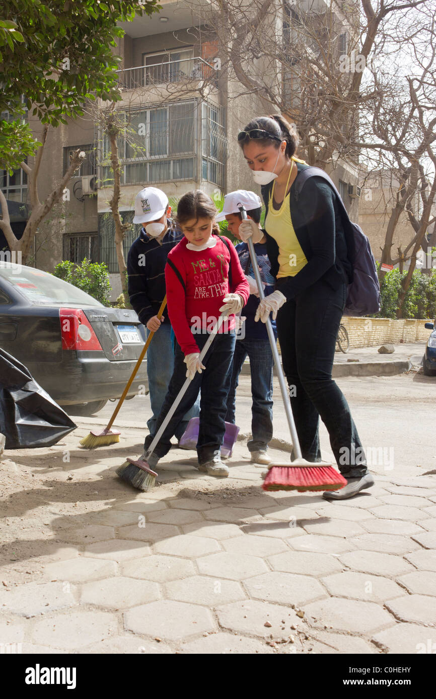 Egyptian schoolchildren sweeping the street in cleanup operation in ...