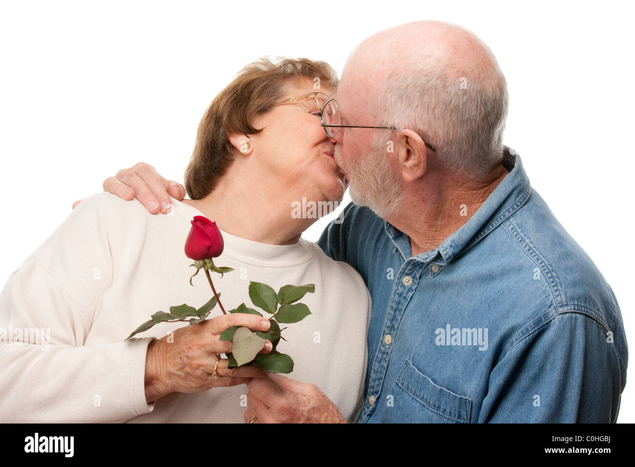 Happy Senior Couple with Red Rose Kissing Isolated on a White ...