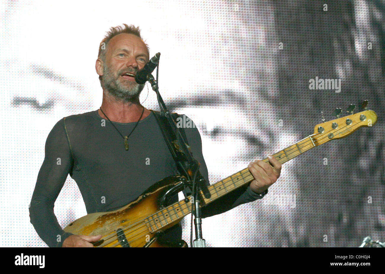 Lead singer Sting of The Police performing in concert in front of ...