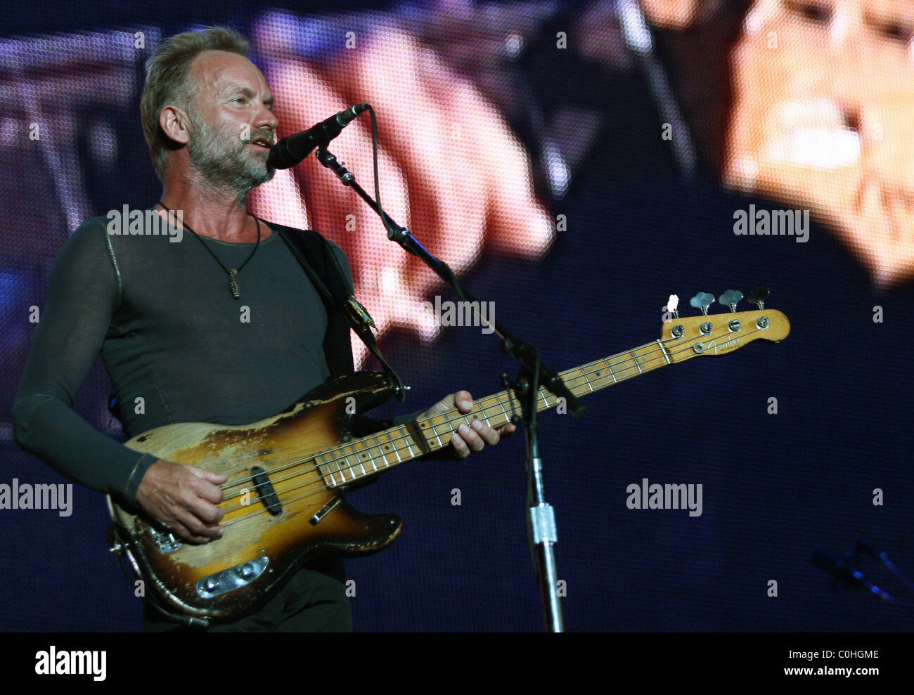 Lead singer Sting of The Police performing in concert in front of ...