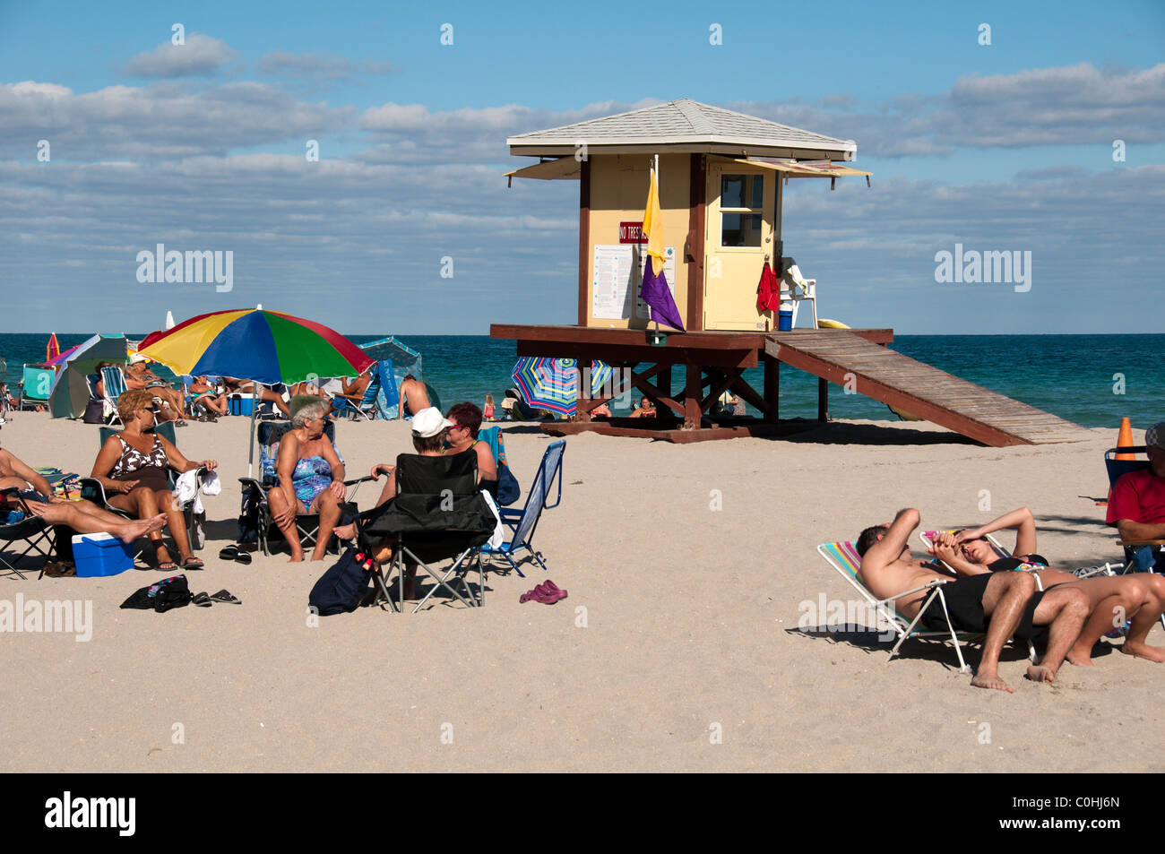 Beach scene with lifeguard shack Stock Photo - Alamy