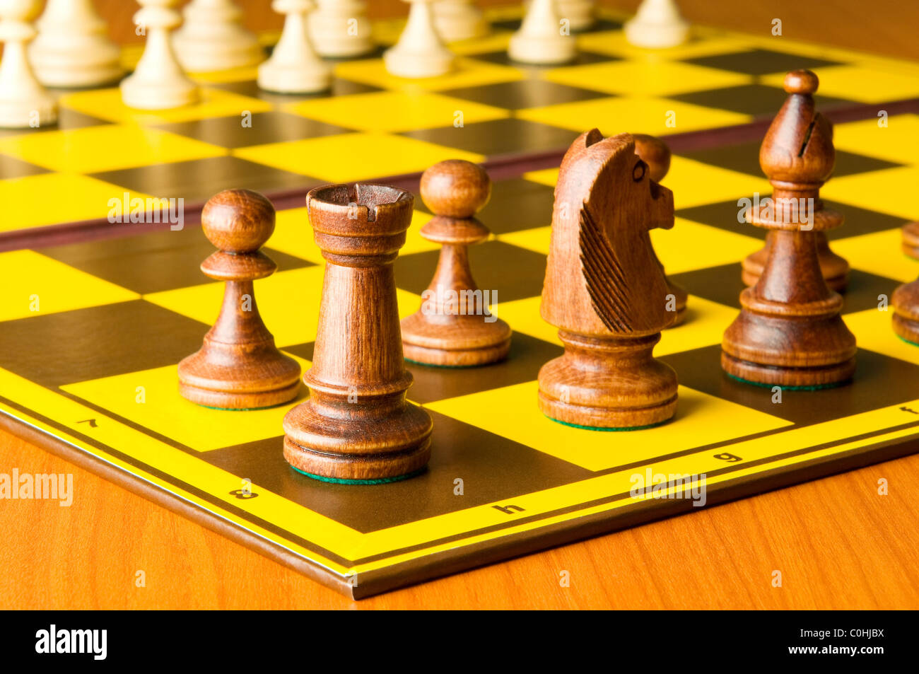 Set of chess figures on the playing board Stock Photo - Alamy