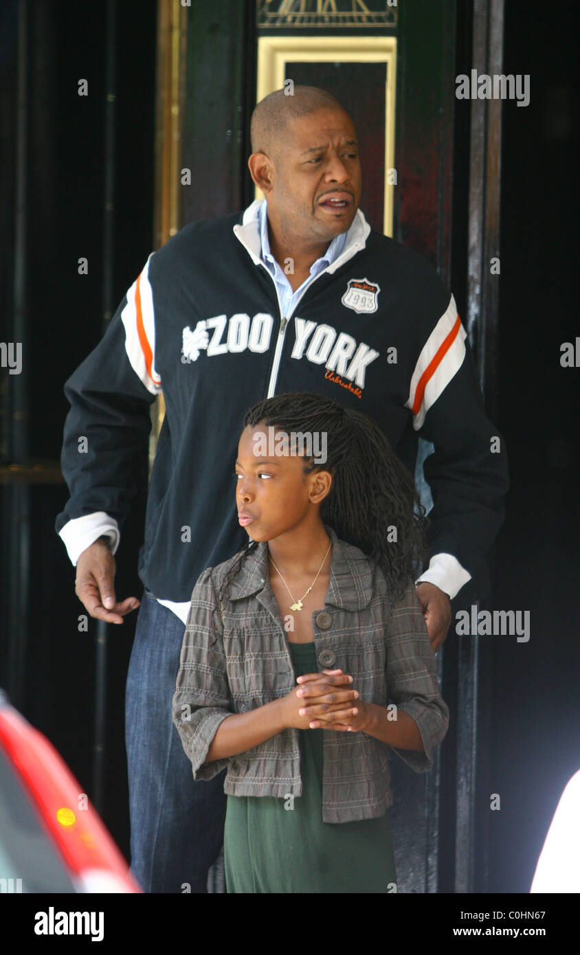 Forest Whitaker and his daughter wait for a taxi outside the Dorchester ...