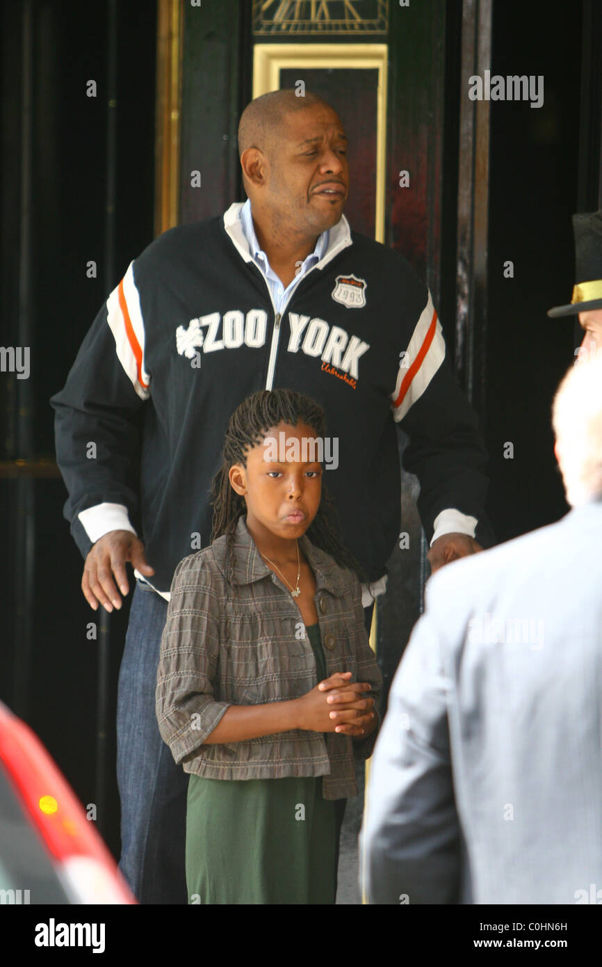 Forest Whitaker and his daughter wait for a taxi outside the Dorchester ...