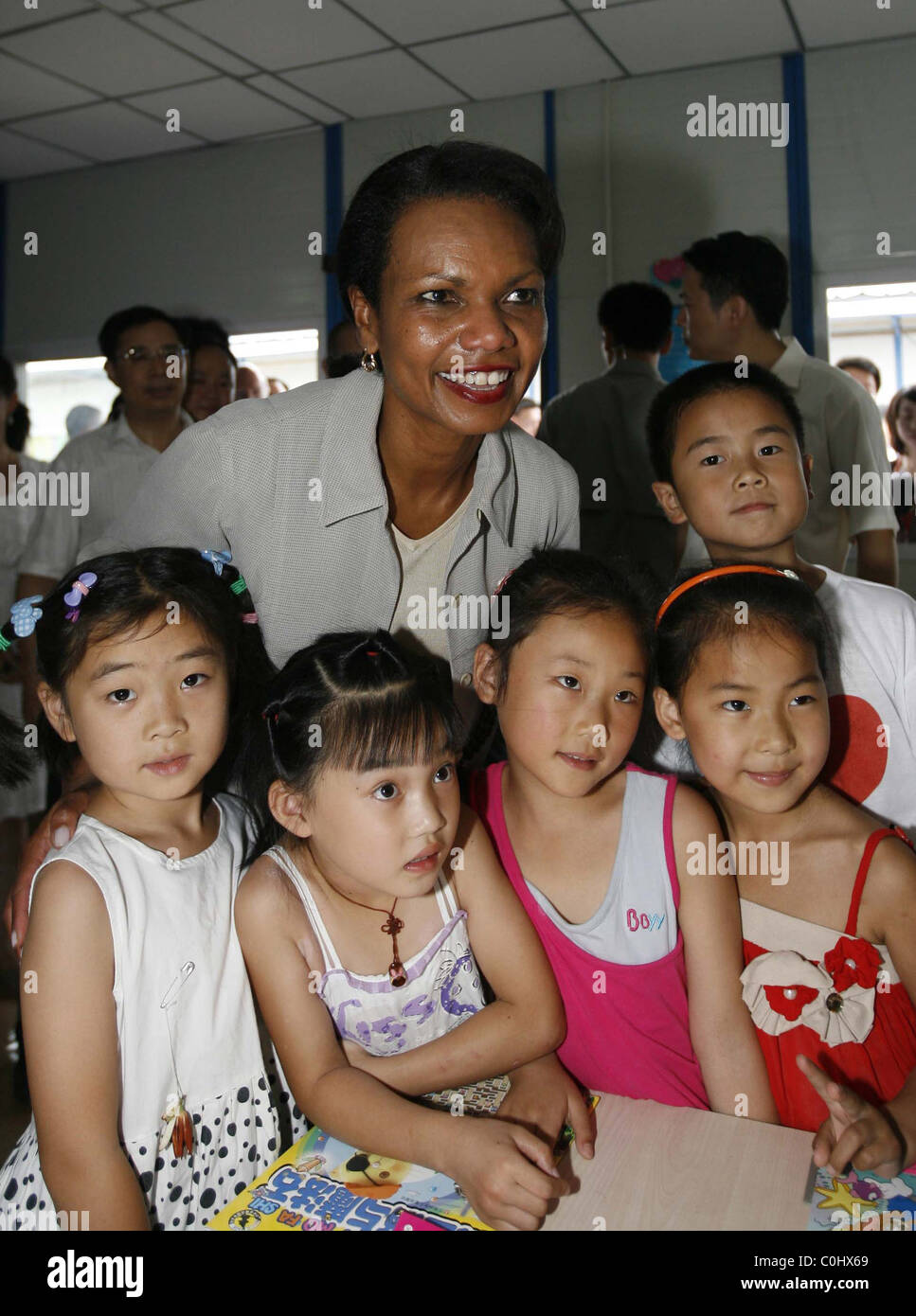 US Secretary of State Condoleezza Rice signs poses for a photograph ...